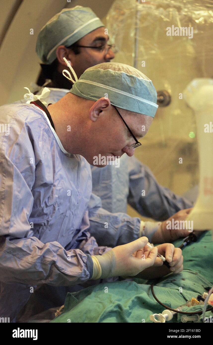 Dr. Matthew Wolff, foreground, head of cardiovascular medicine at UW ...