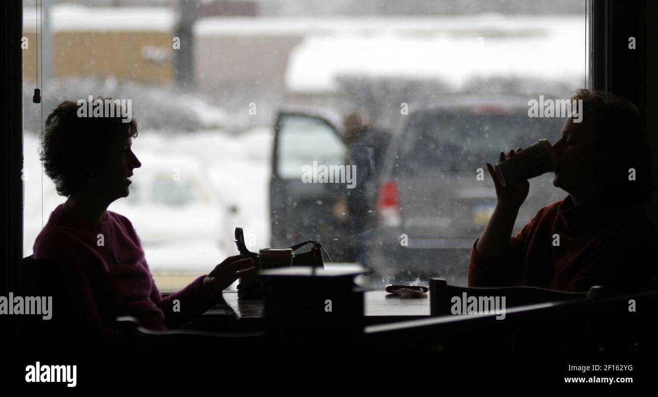 Patrons of Jitters coffee shop in Anchorage, Alaska talk and sip coffee ...