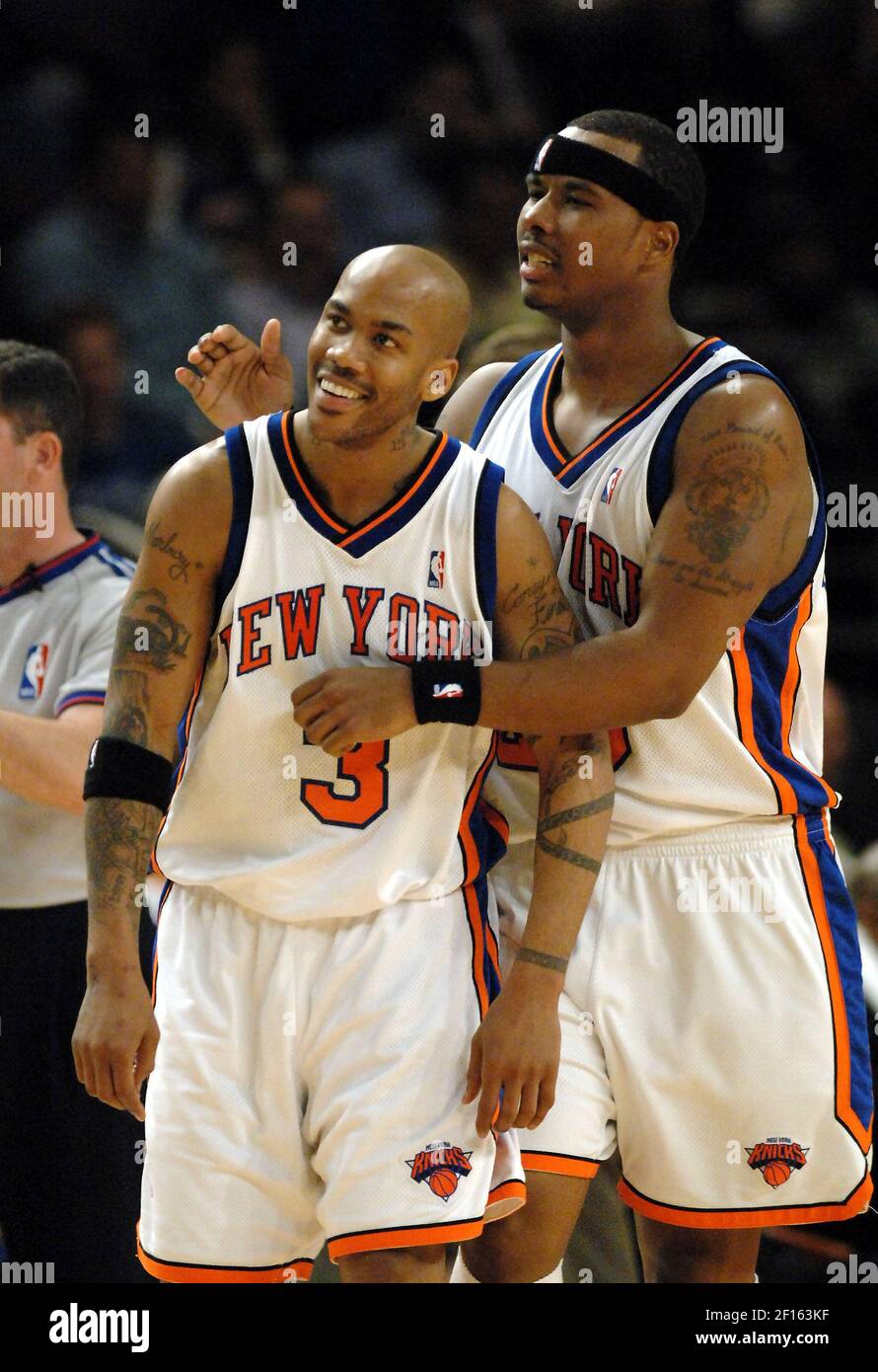 The New York Knicks Stephon Marbury is hugged by teammate Quentin ...