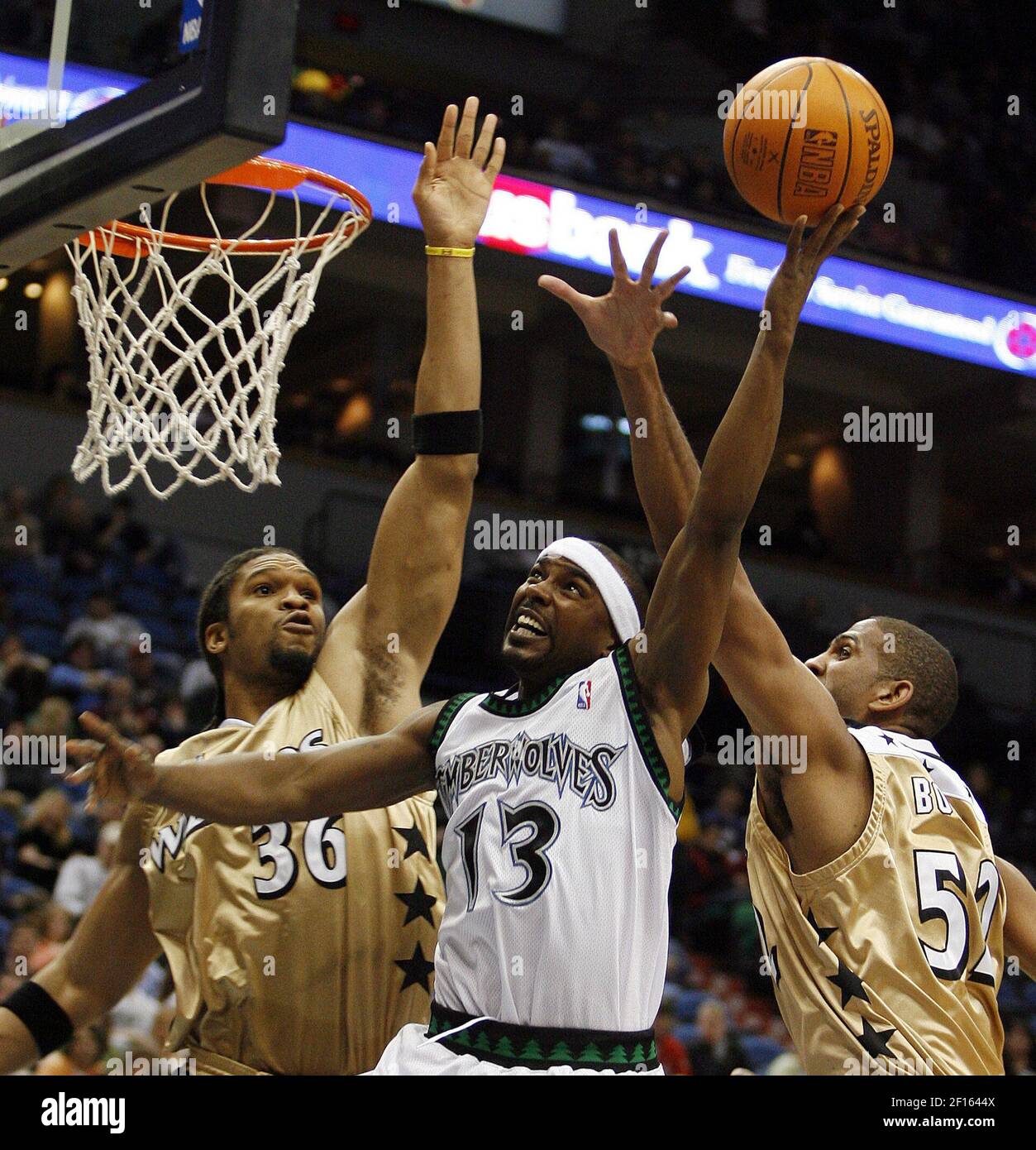 Minnesota Timberwolves' Mike James splits Washington Wizards defenders ...