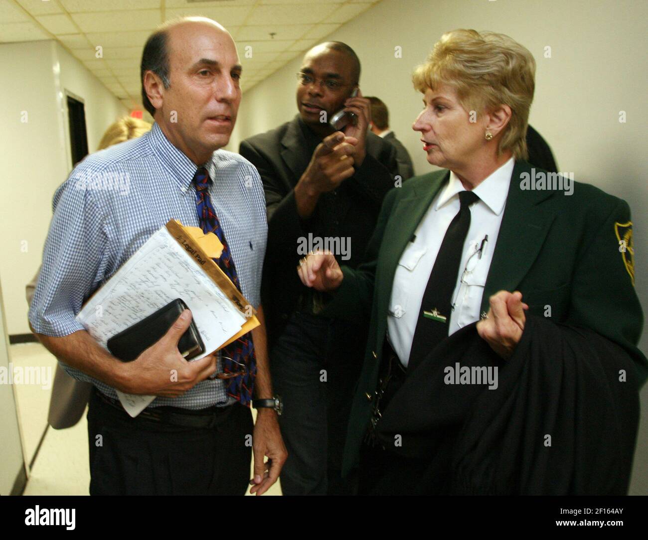 Judge Larry Seidlin talks with a court deputy during a recess of the ...
