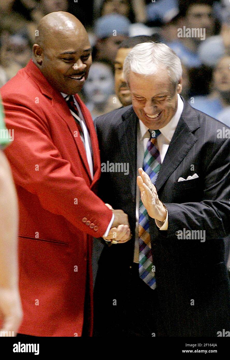 North Carolina State head coach Sidney Lowe greets North Carolina's Roy ...