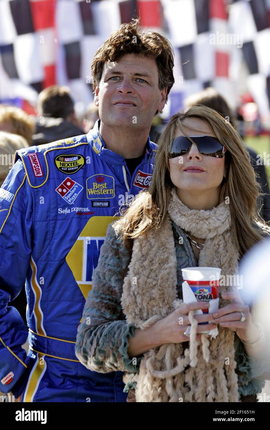 Driver Michael Waltrip and his wife Buffy watch the pre-race show ...