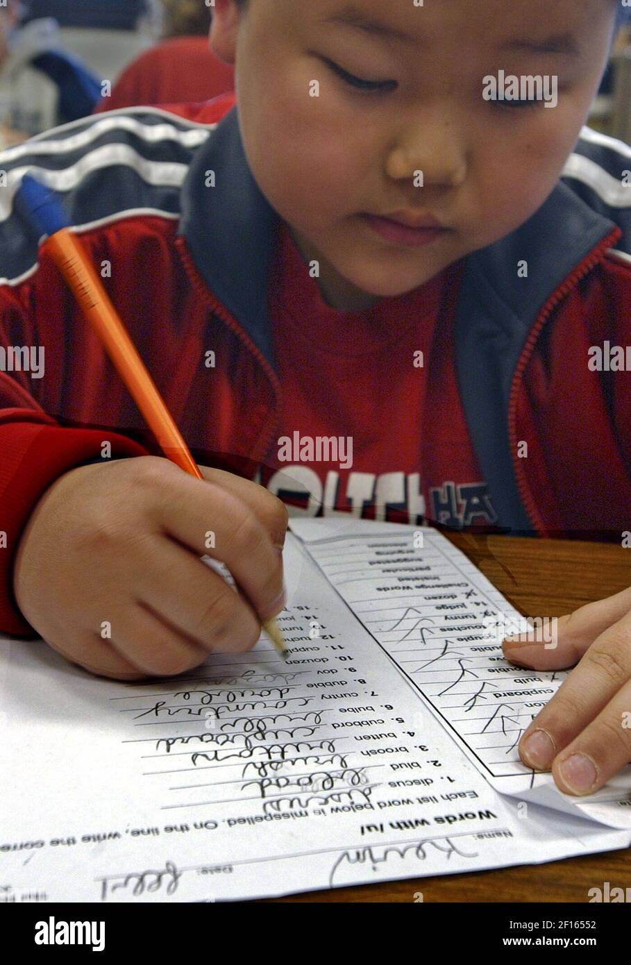 Horace Mann School third grader Kevin Yang uses cursive writing to ...