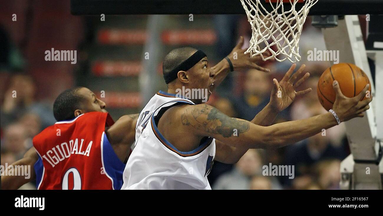 Philadelphia 76ers' Andre Iguodala (left) is unable to stop Washington ...
