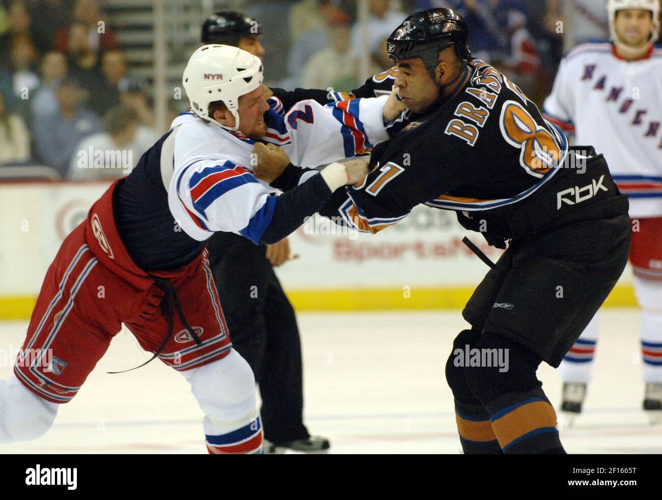 The New York Rangers Colton Orr, left, squares off against the ...