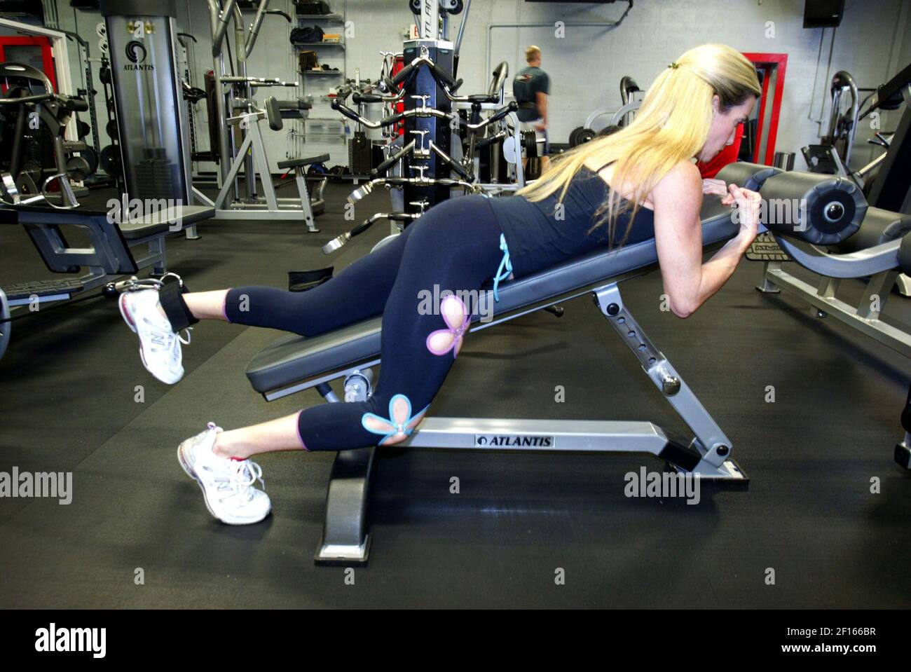 Nancy Cole demonstrates the decline single-leg cable curl. (Photo by ...