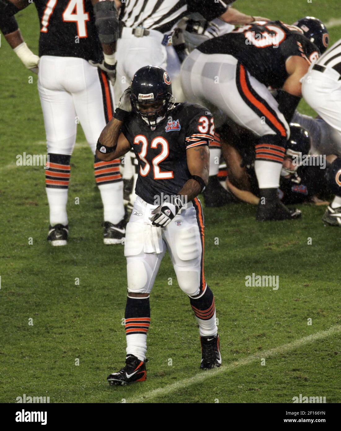 The Chicago Bears' Cedric Benson (32) walks off the field after ...