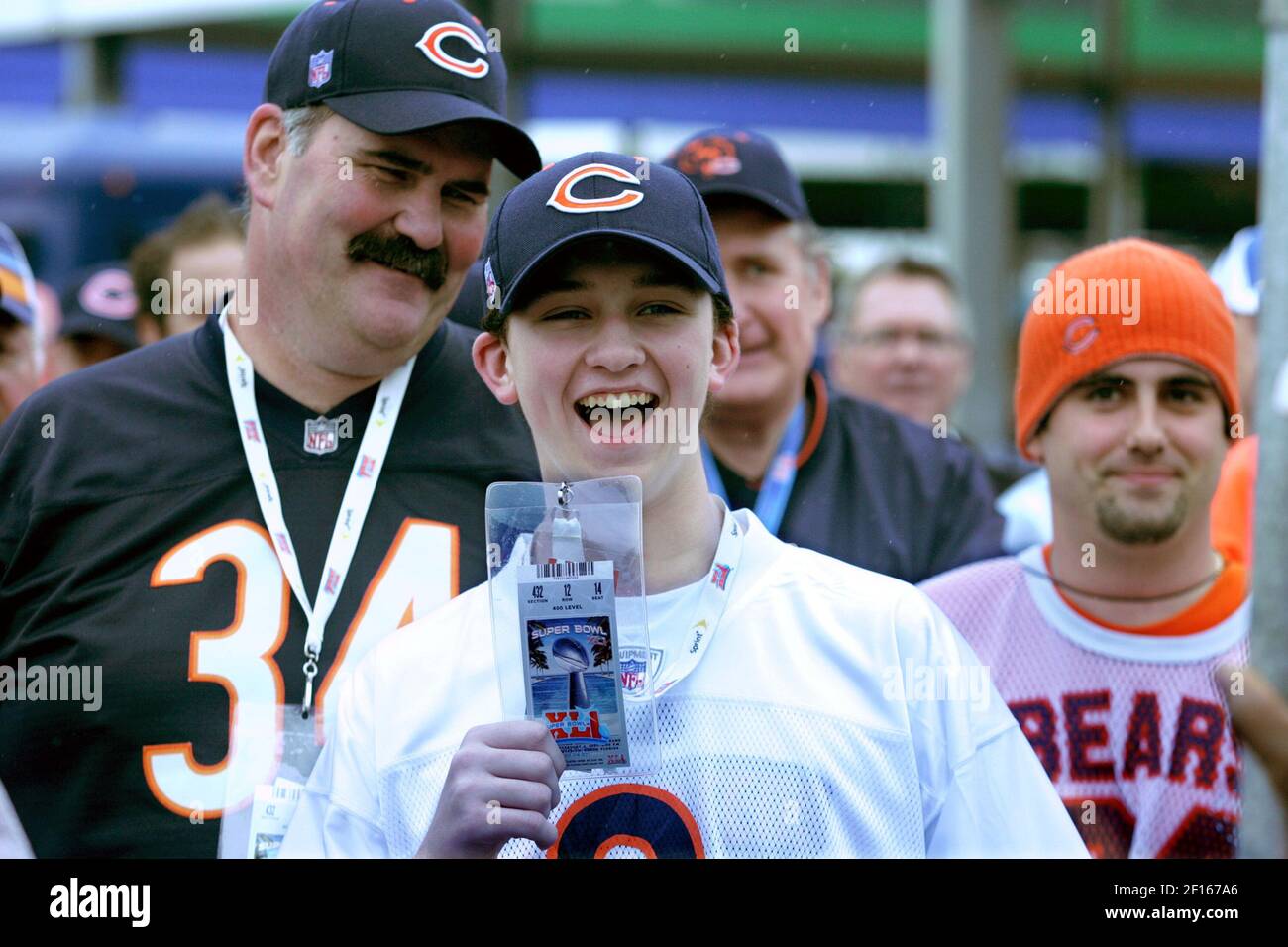 John Berman of New Jersey flashes his ticket as he waits in line to ...
