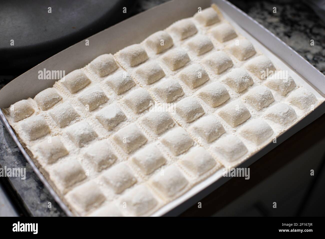 Raw italian ravioli in box ready to be cooked Stock Photo - Alamy