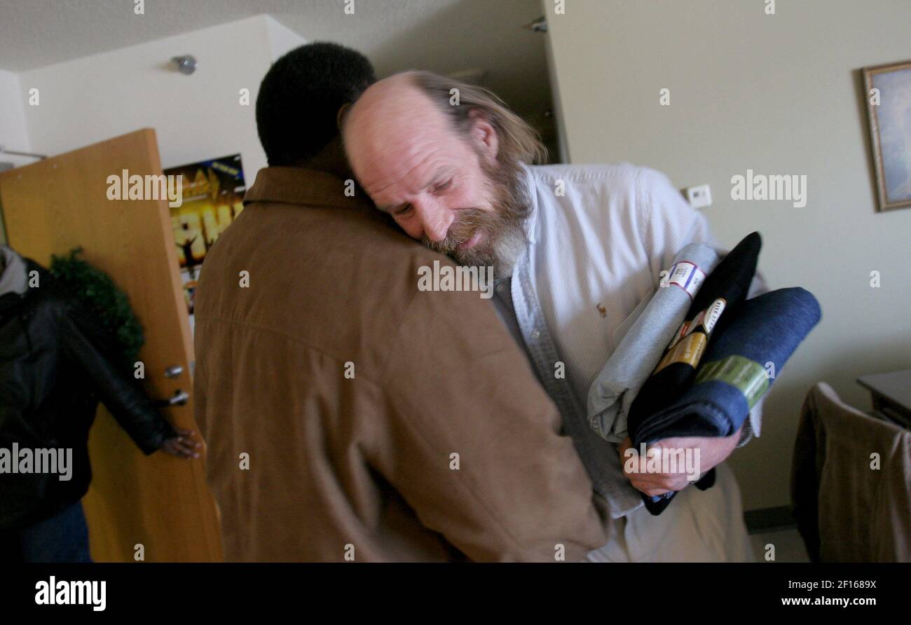 Will Wallace receives a big hug from Mike William (right) after Wallace ...