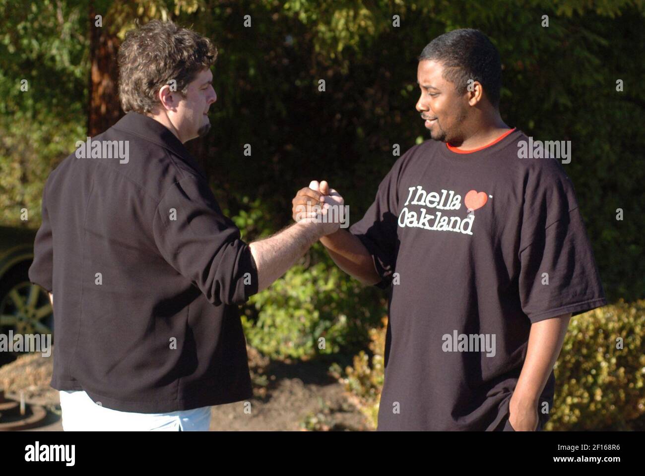 Tony Hicks, left, and Marcus Thompson give a 70's soul handshake ...