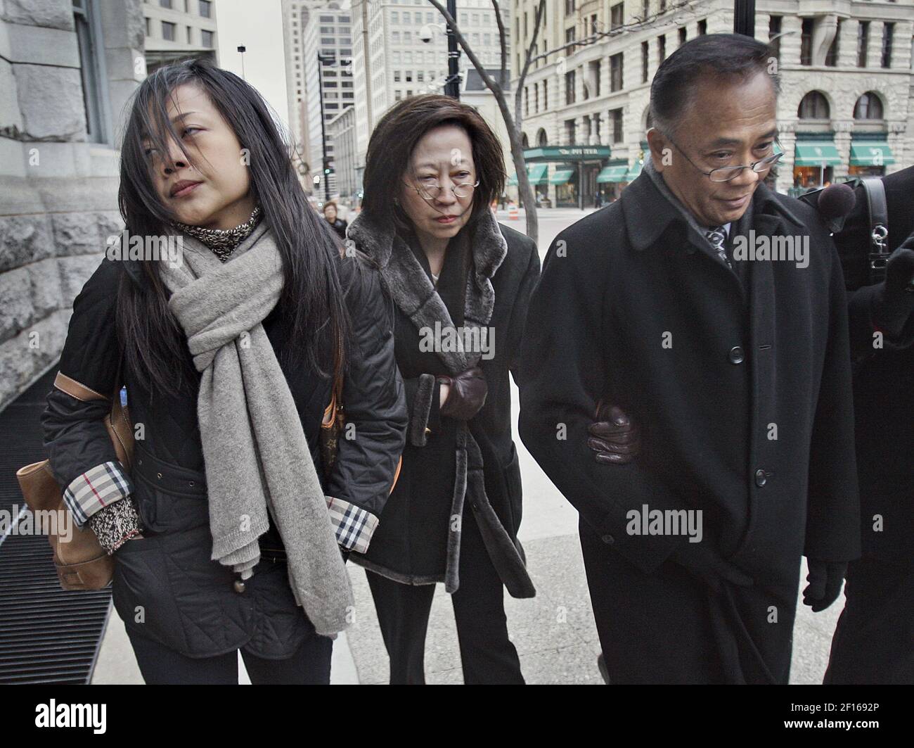Jefferson N. Calimlim (right) his wife, Elnora Calimlim (center), and ...