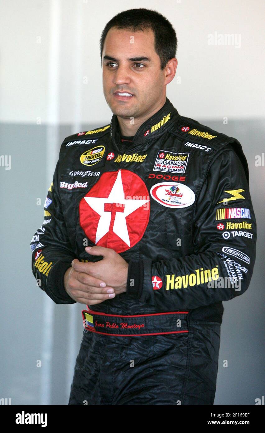 Juan Pablo Montoya, driver for the No. 42 Texaco/Havoline Dodge, stands ...