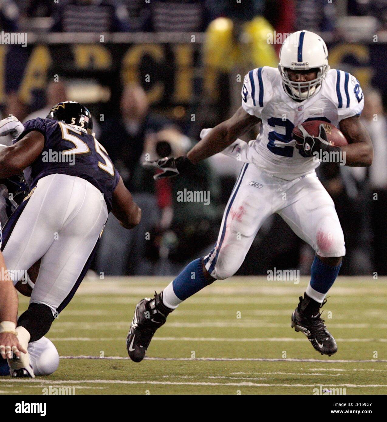Indianapolis Colts Joseph Addai (29) avoids the tackle of Baltimore ...