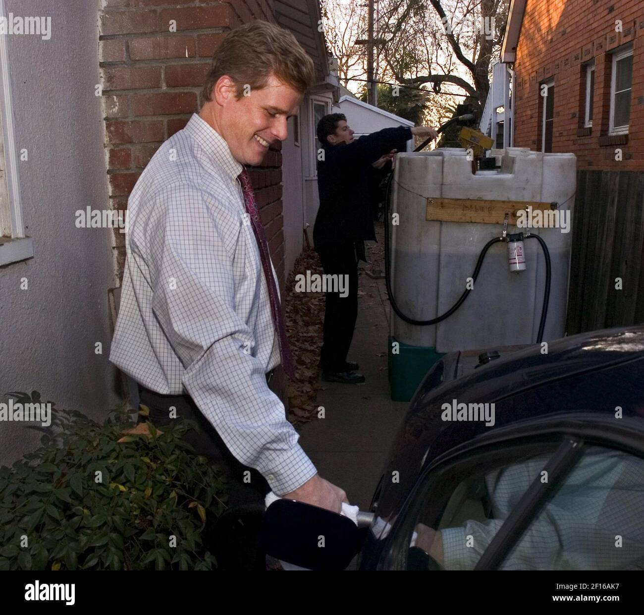 Will Semmes, left, fills his tank with biodiesel fuel provided by ...