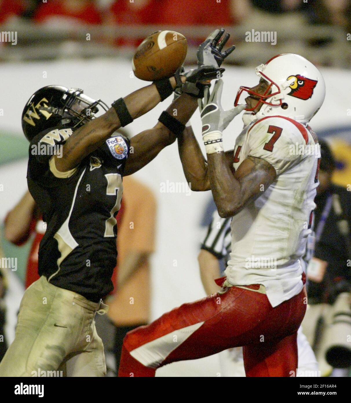 Wake Forest's Riley Swanson breaks up a pass intended for Louisville's ...
