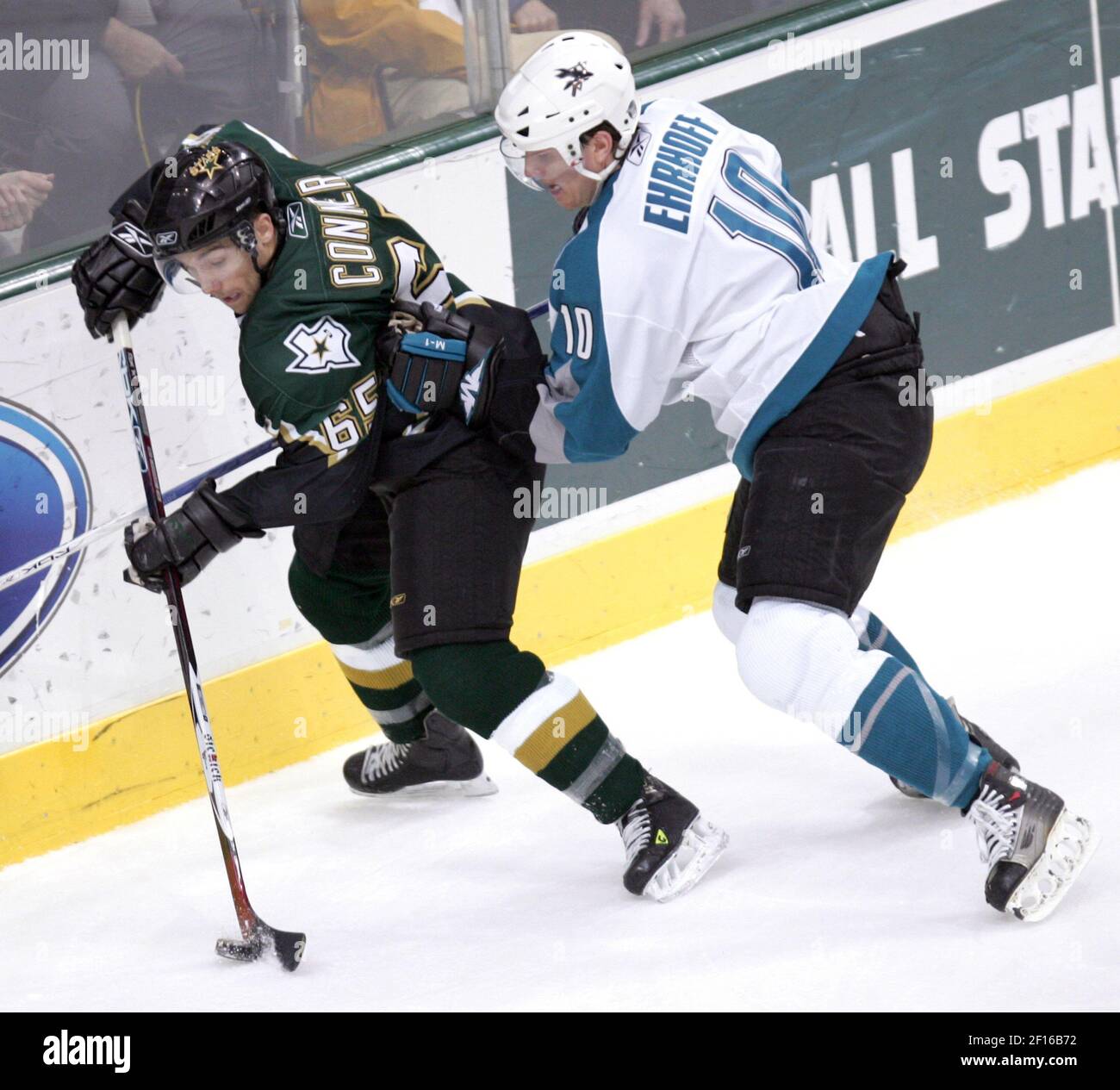 The Dallas Stars' Chris Coner (lfet) attempts to protect the puck from ...