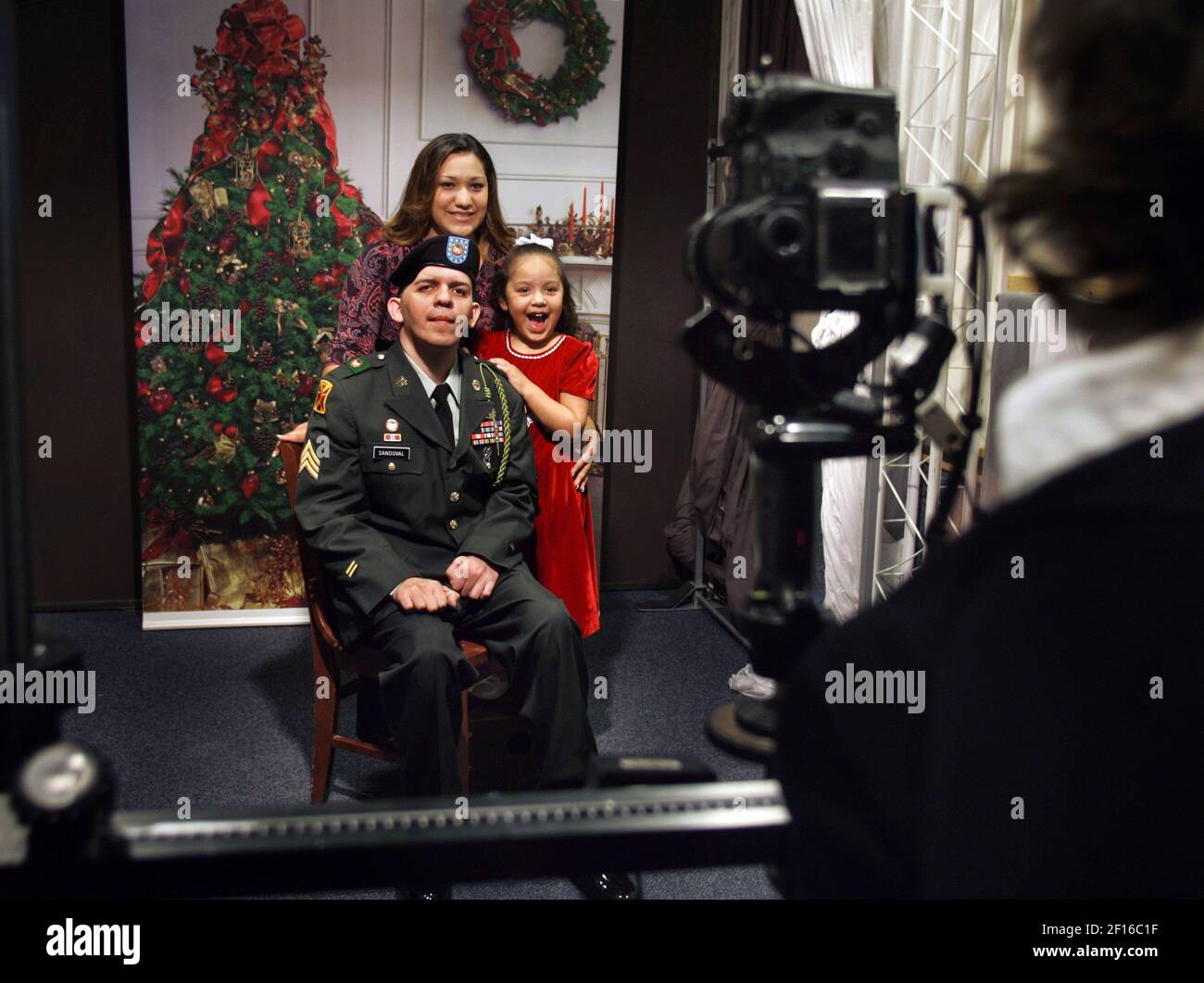 Wearing his Army dress uniform, Sgt. Frank Sandoval, poses with his ...