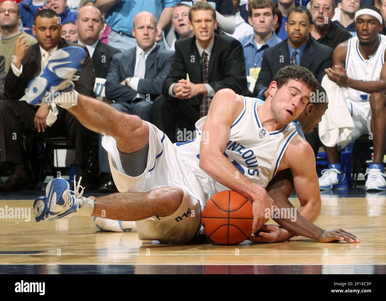 St. Louis guard/forward Luke Meyer scrambles on the floor for a loose ...
