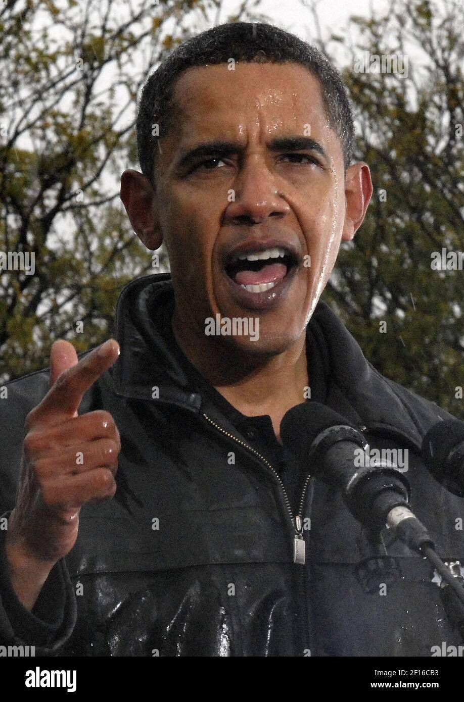 Democratic presidential candidate Barack Obama speaks in the pouring ...