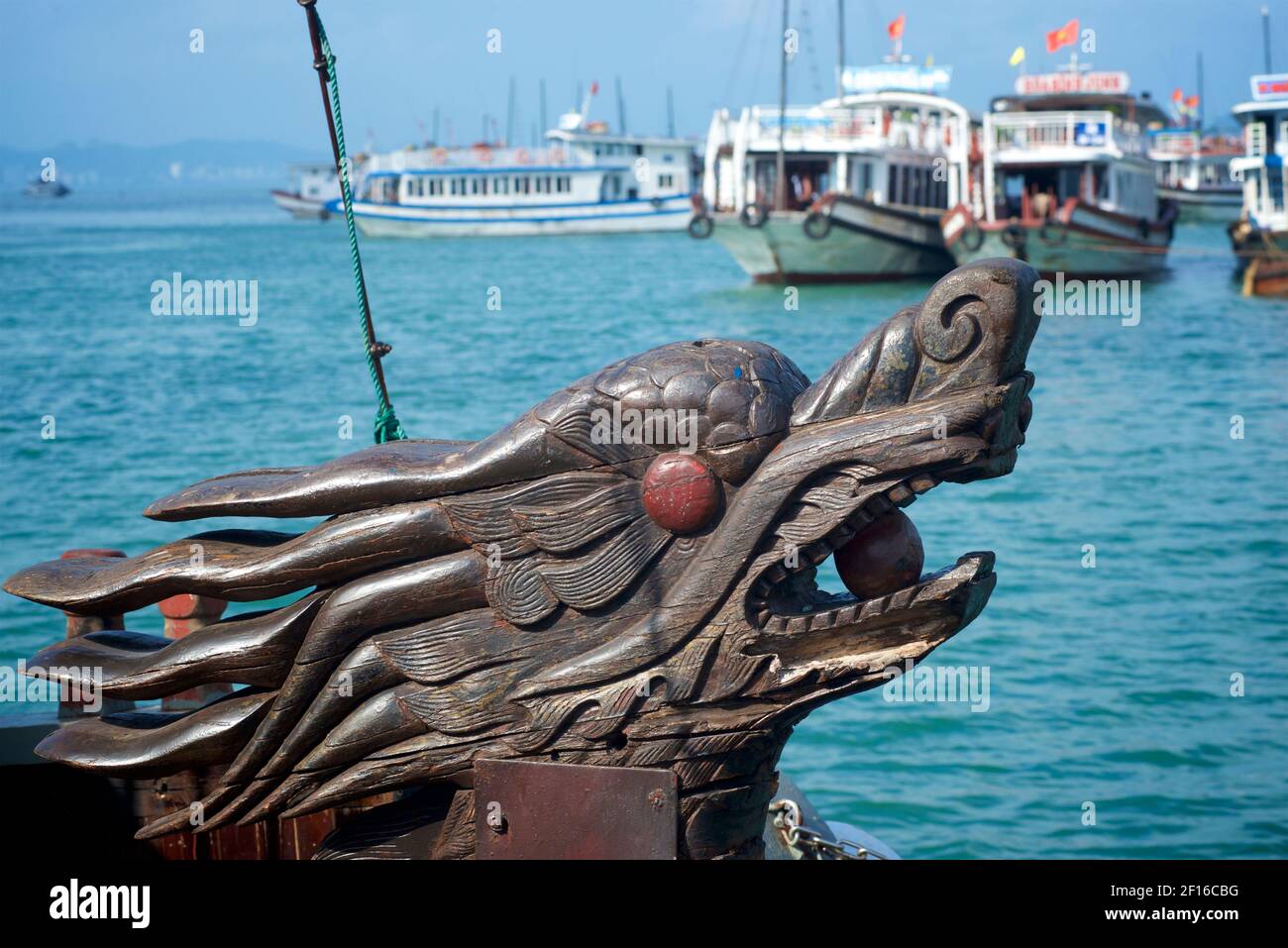 Detail of carved wooden prow of a boat, Halong Bay, northern Vietnam. A ...