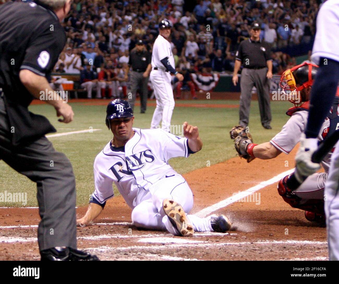 The Tampa Bay Rays' Carlos Pena scores on an RBI double by Evan ...
