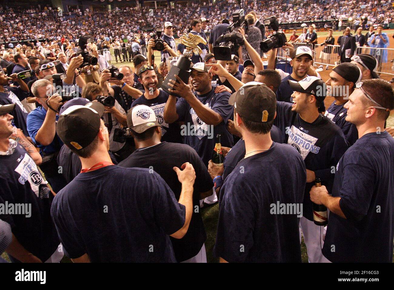 The Tampa Bay Rays hold the American League Championship trophy after ...