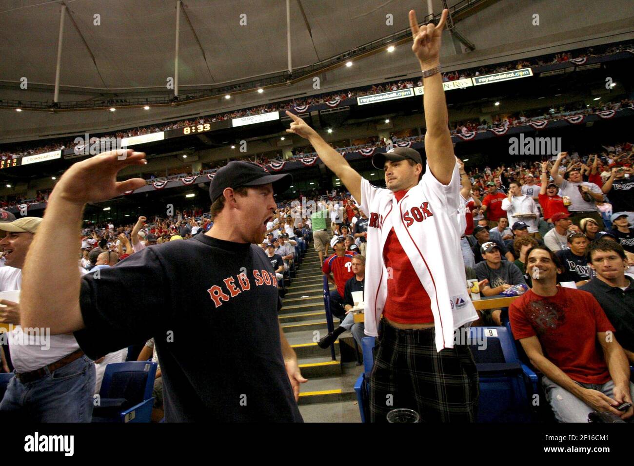 Boston Red Sox fans Zach Lezinski, left, and Brad Boscko celebrate as ...