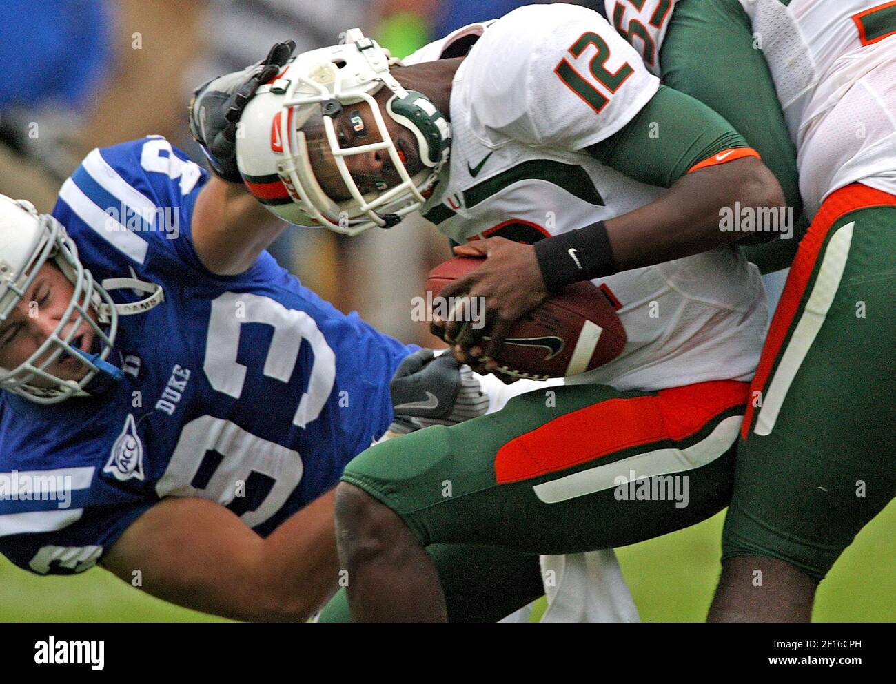 Miami quarterback Jacory Harris (12) is sacked by Duke's Charlie ...