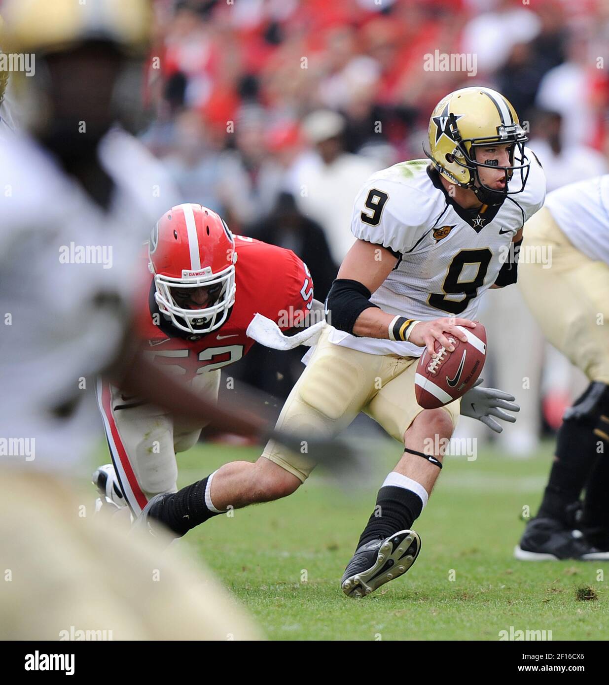 Vanderbilt quarterback Mackenzi Adams (9) tries to scramble away from ...