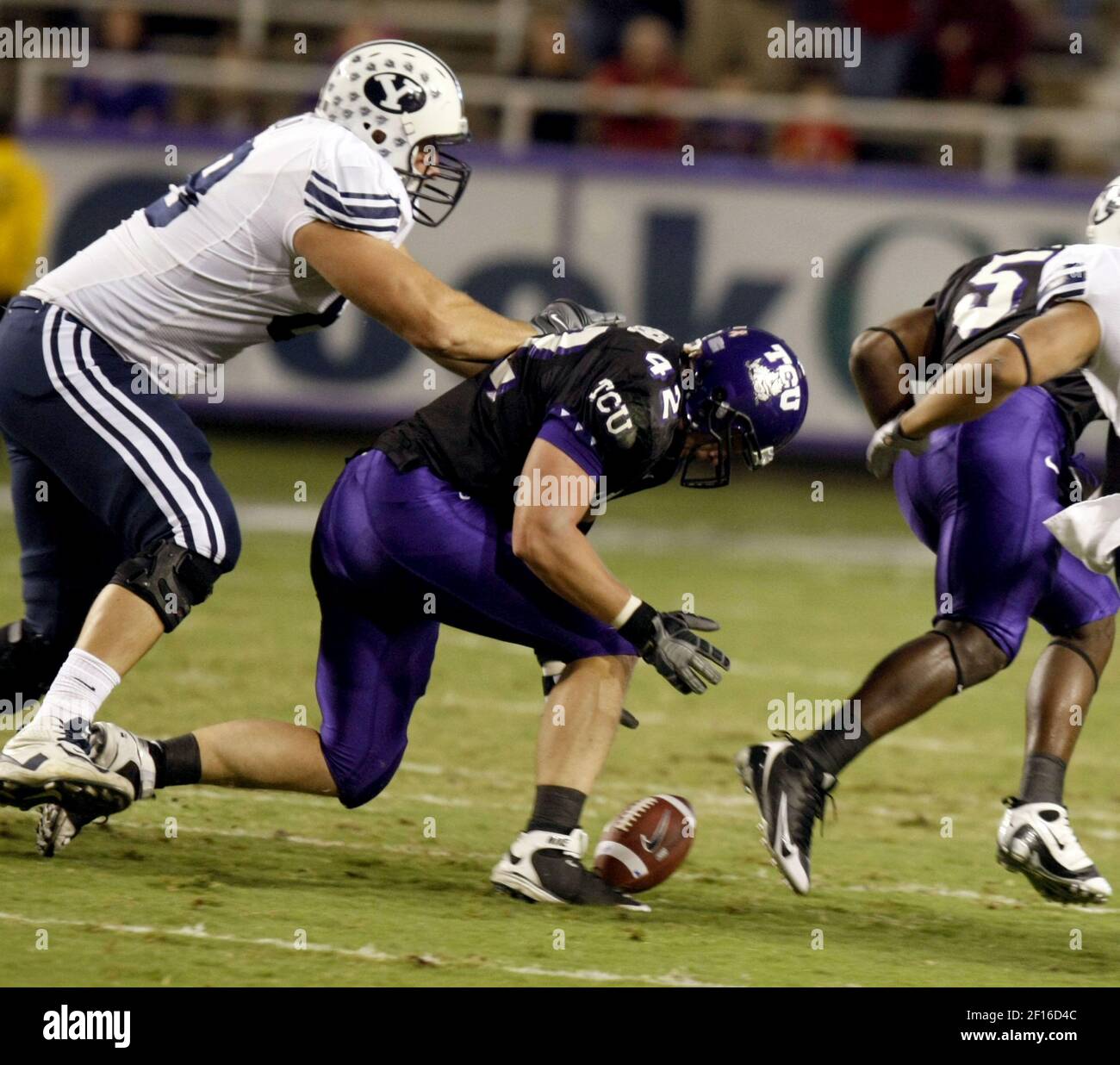 Texas Christian's Matt Panfil recovers a fumble as Brigham Young's ...