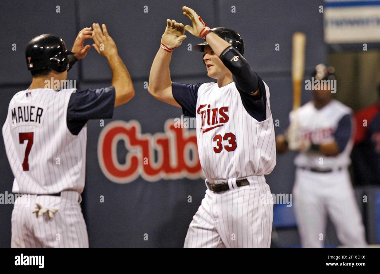 Minnesota Twins first baseman Justin Morneau (right) celebrates with ...