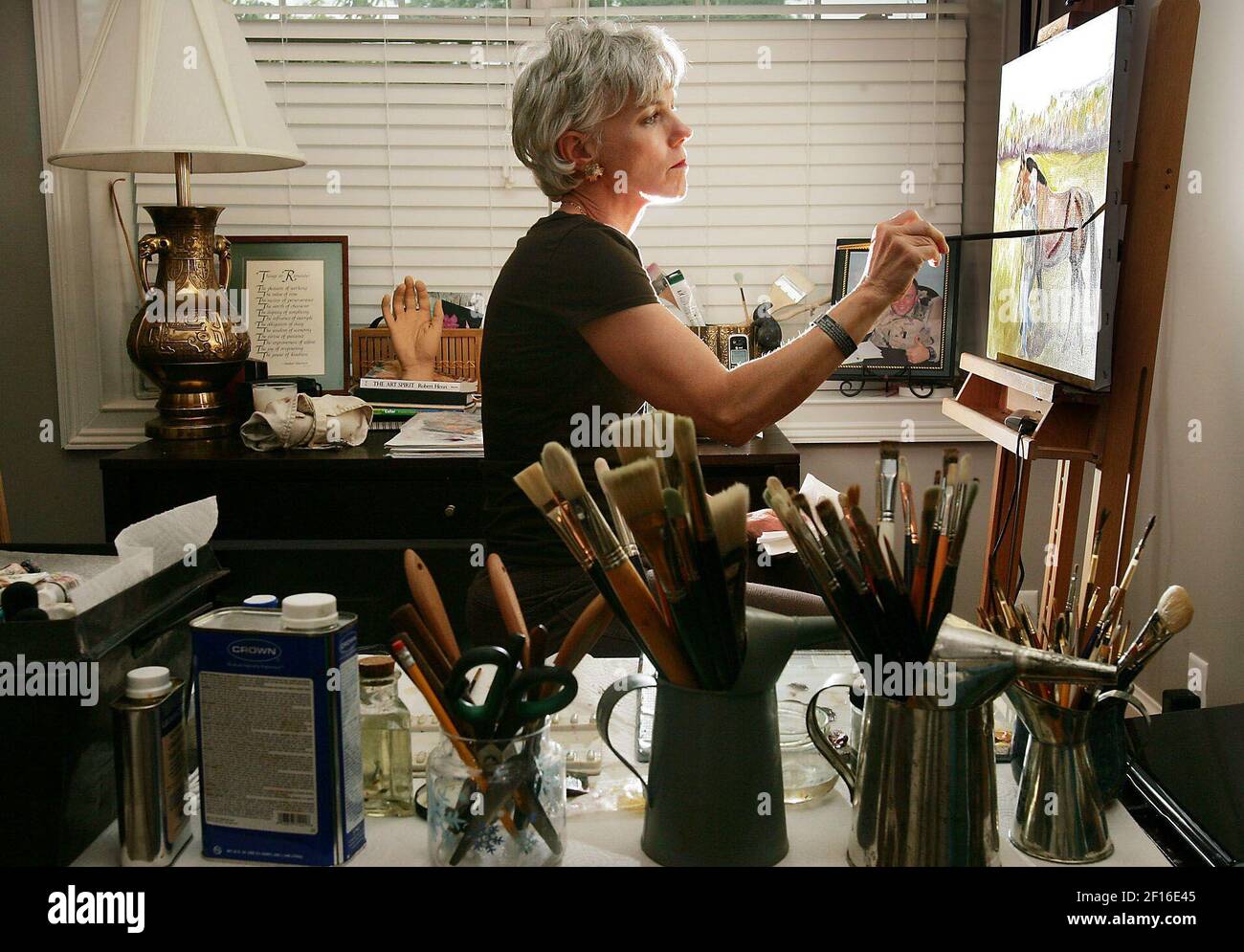 Suzy Shealy works on an oil painting in her Columbia, South Carolina ...