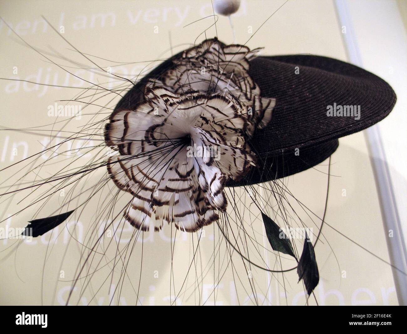 Black and white feathers in a floral shape put a finishing touch on a ...