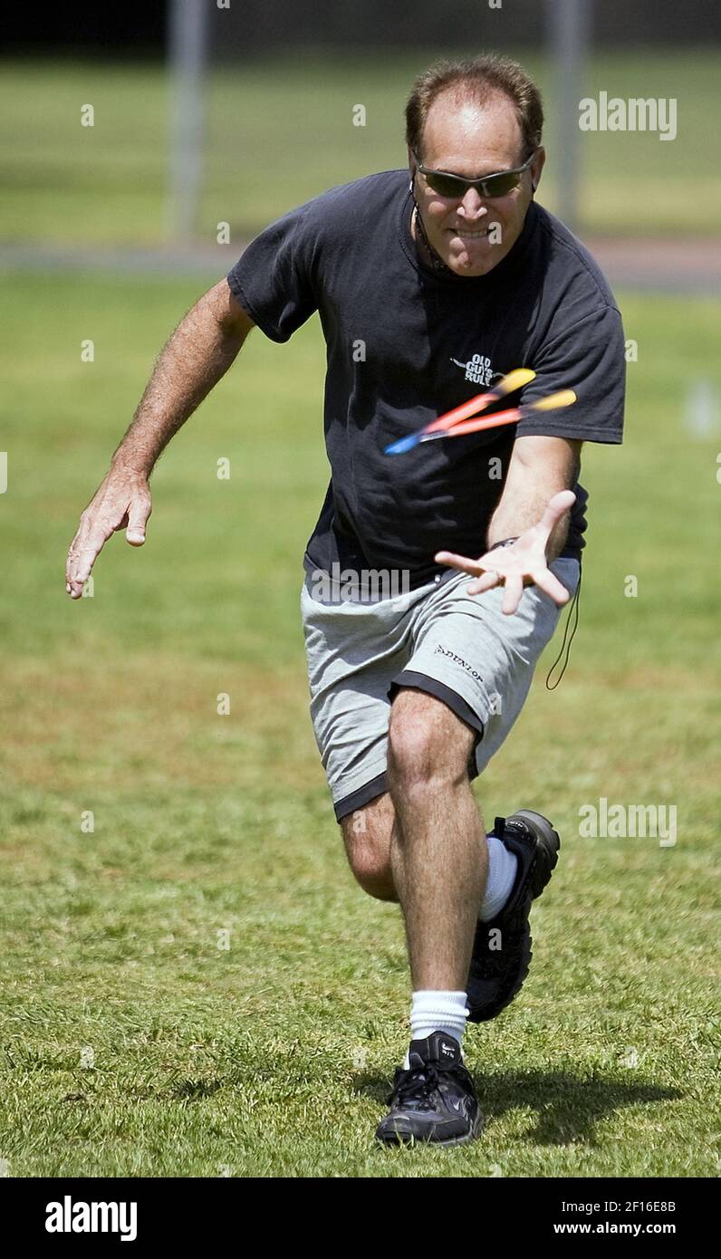 Joseph Bossenmaier catches his boomerang that he uses when he exercises ...