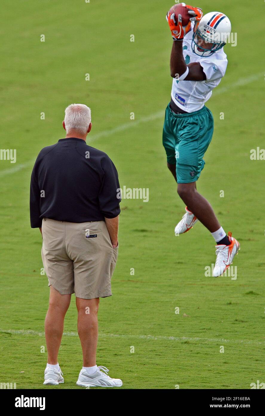 Miami Dolphins wide receiver Justin Wynn catches a pass in front of ...