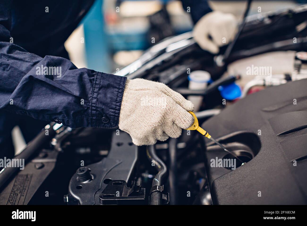 Mechanic checking engine hi-res stock photography and images - Alamy