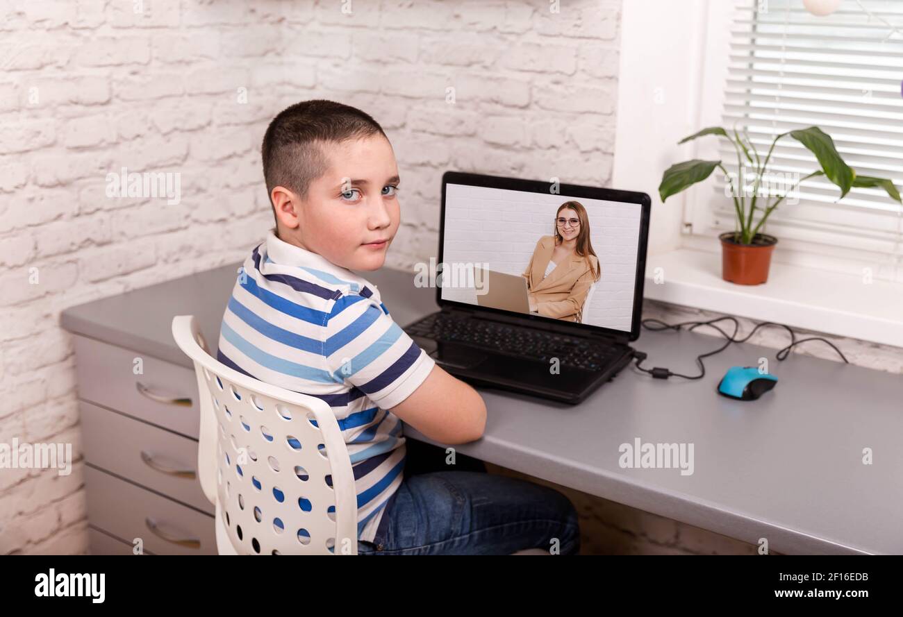 Boy student video conference e-learning with teacher on computer Stock ...
