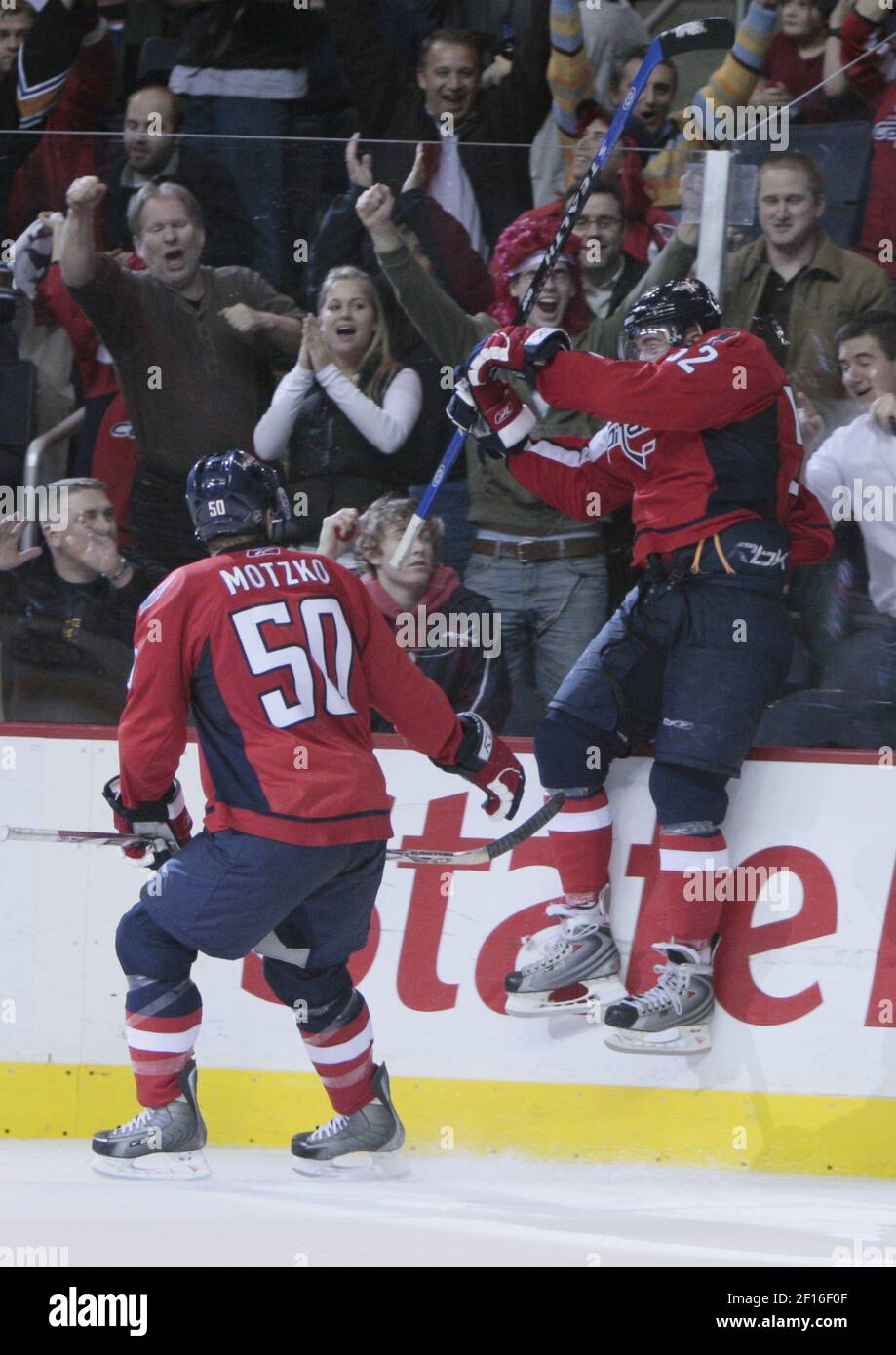 The Washington Capitals Mike Green (left) celebrates his game-winning ...