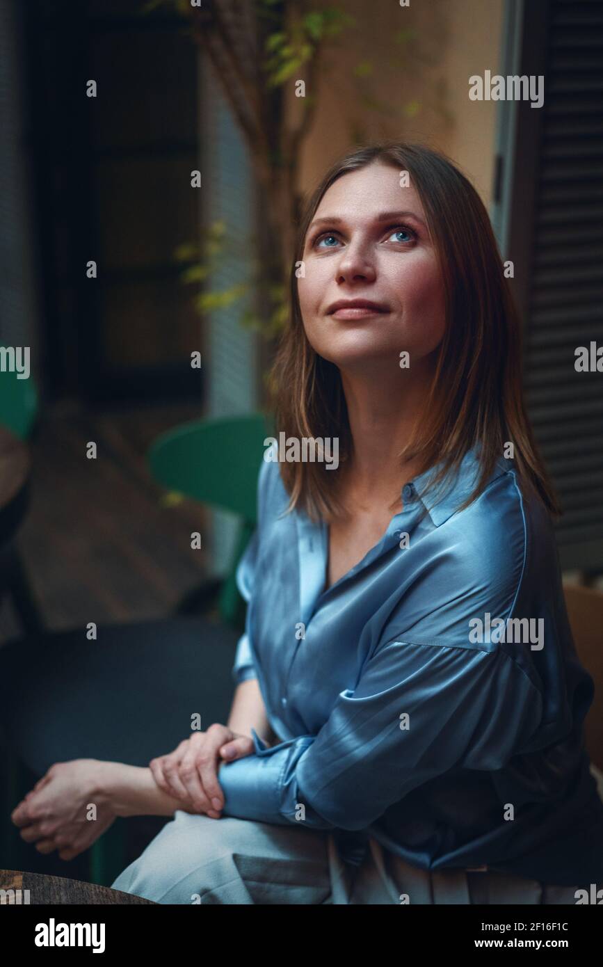 Woman portrait, in a cafe close up dreamy facial expression Stock Photo ...