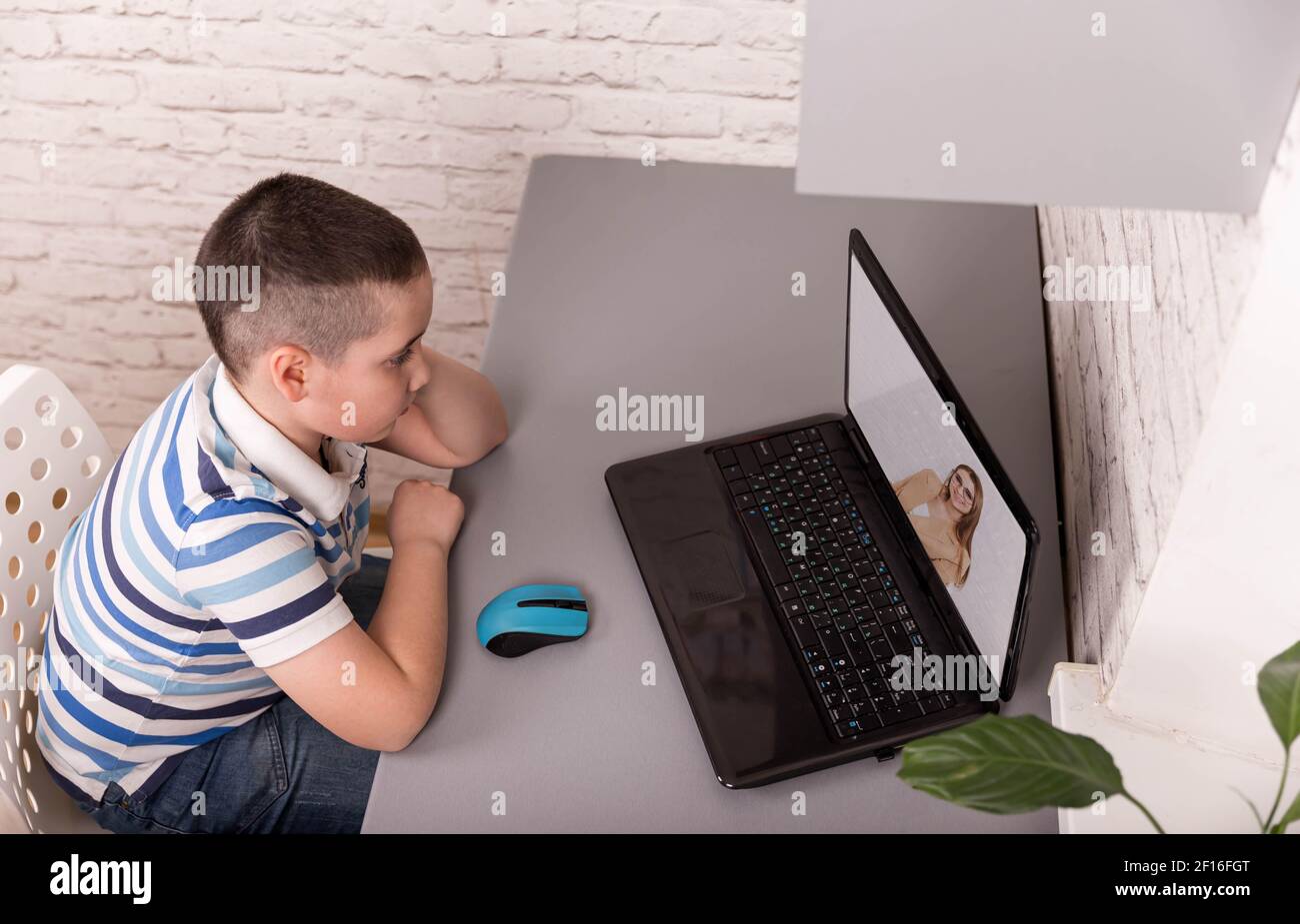 Child using gadgets to study. Education and distance learning for kids ...