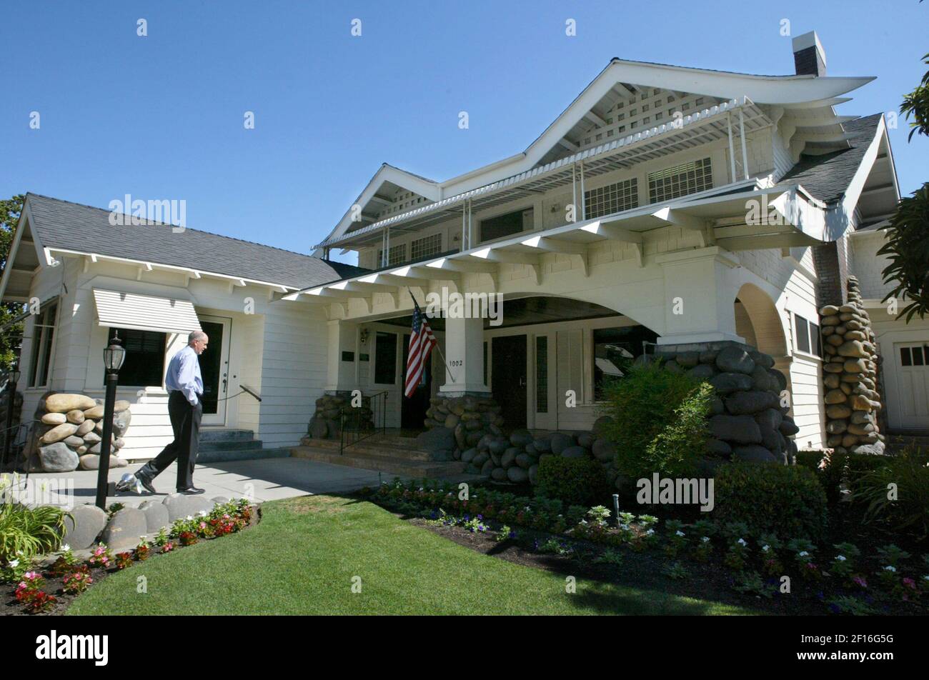 Bill Phipps, a partner in Yost & Webb Funeral Home, walks down the ...