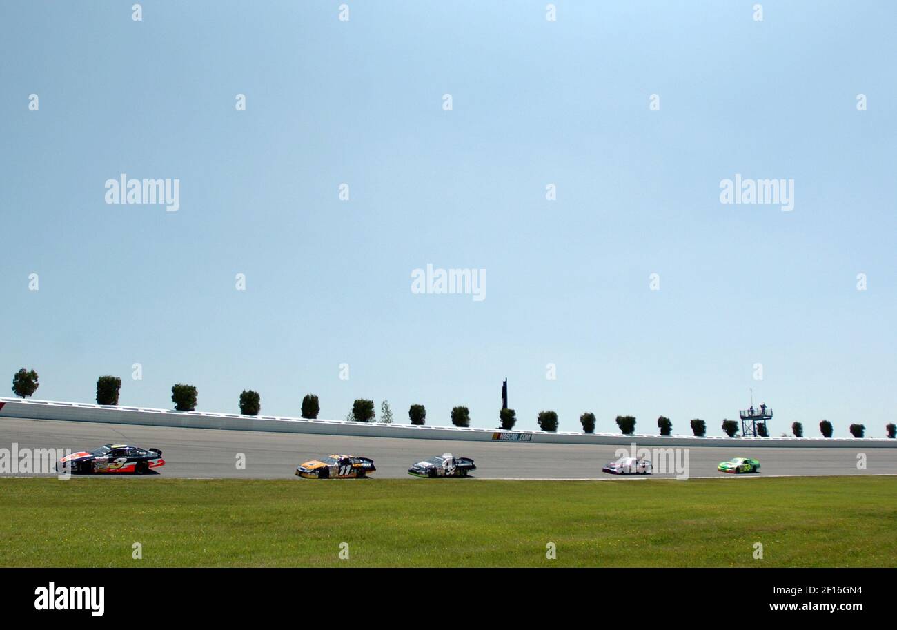 Cars drive through turn one in the Arca Pocono 200 Race at the Pocono ...