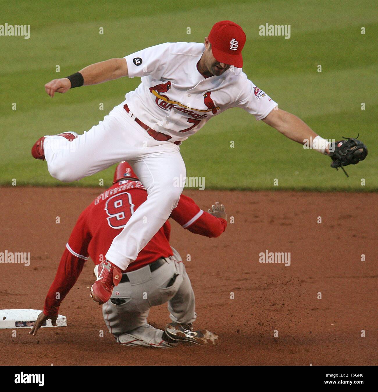 St. Louis Cardinals second baseman Adam Kennedy is drawn off the bag by ...