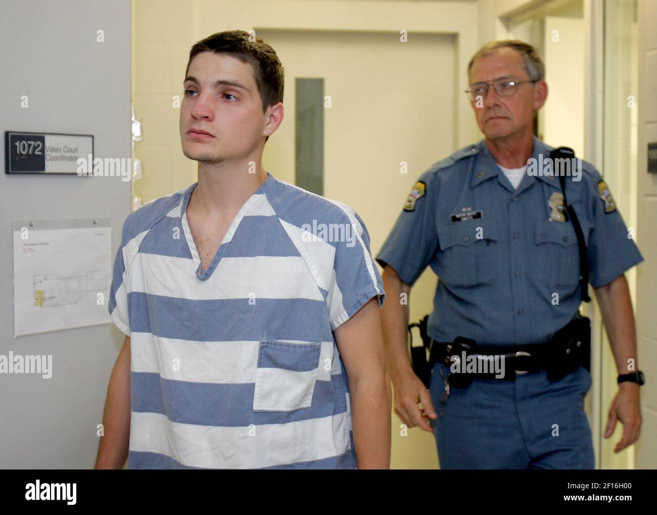 Edwin Hall is escorted to a video court appearance on Thursday, June 7 ...