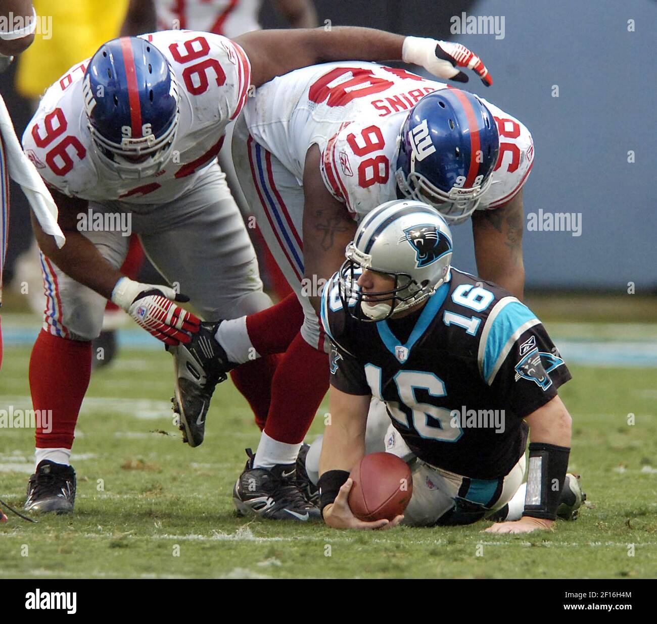 Carolina Panthers quarterback Chris Weinke (16) is downed by New York ...