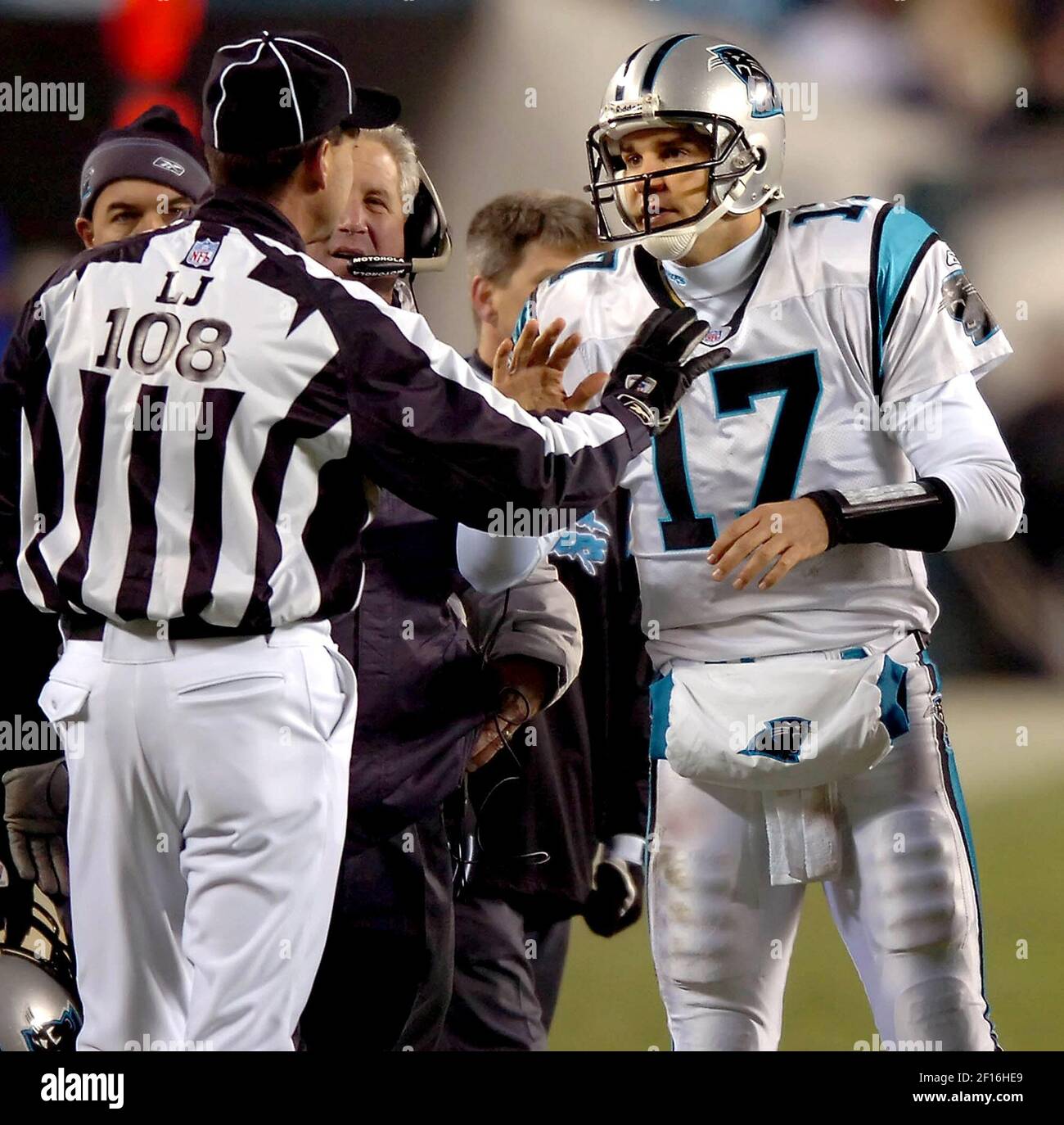 Carolina Panthers' Jake Delhomme (17) and head coach John Fox confer ...