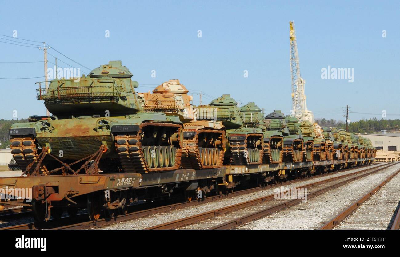 U.S. military tanks sit on rail cars Tuesday, December 5, 2006, waiting ...