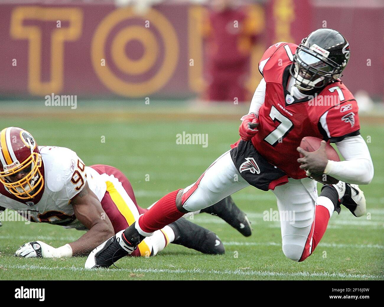 Atlanta Falcons quarterback Michael Vick (7) is tripped by Washington ...